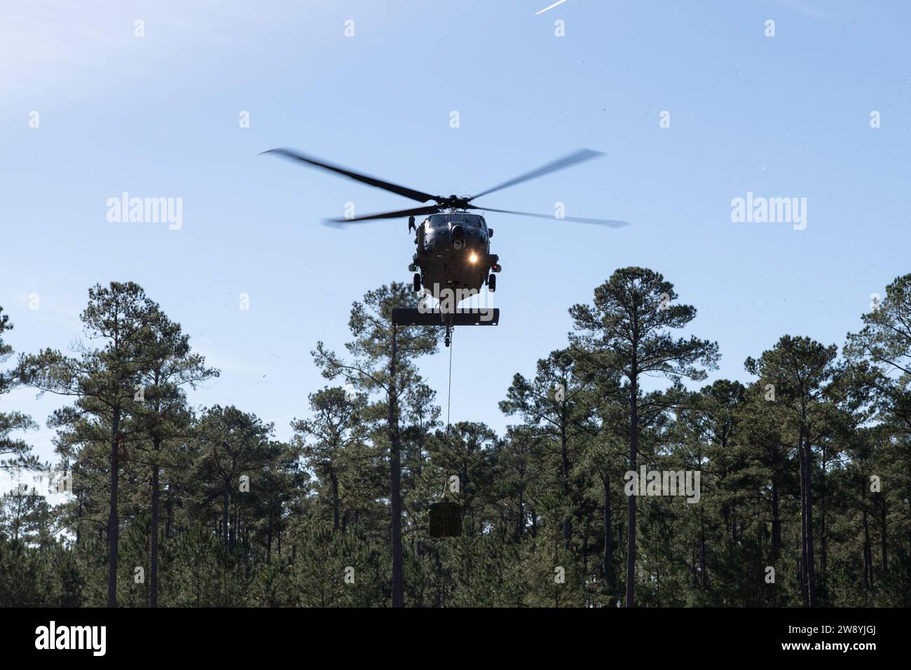 A 41st Rescue Squadron HH-60W Jolly Green II takes off with sling ...