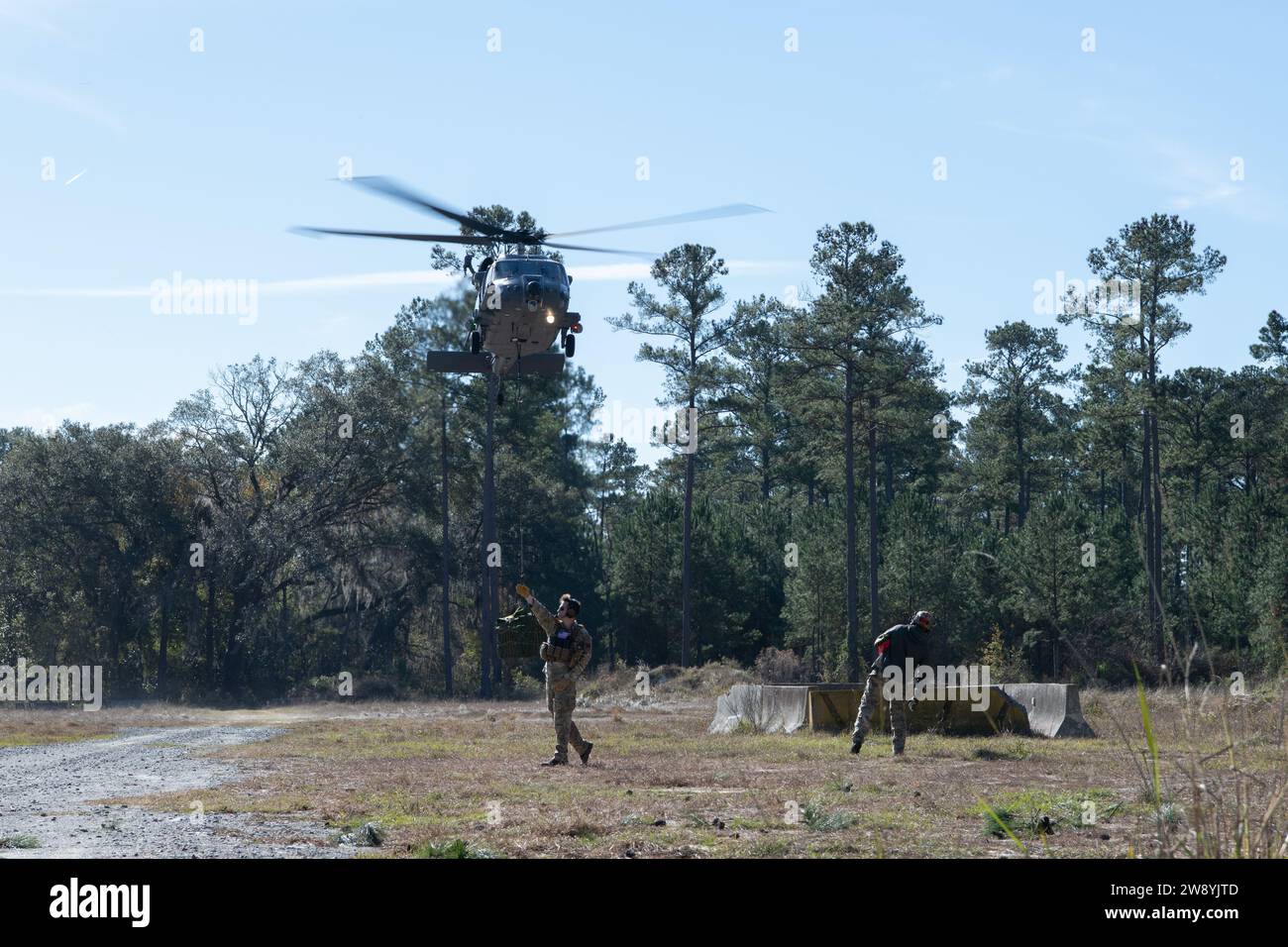 820th Base Defense Group Airmen give signals to a 41st Rescue Squadron ...