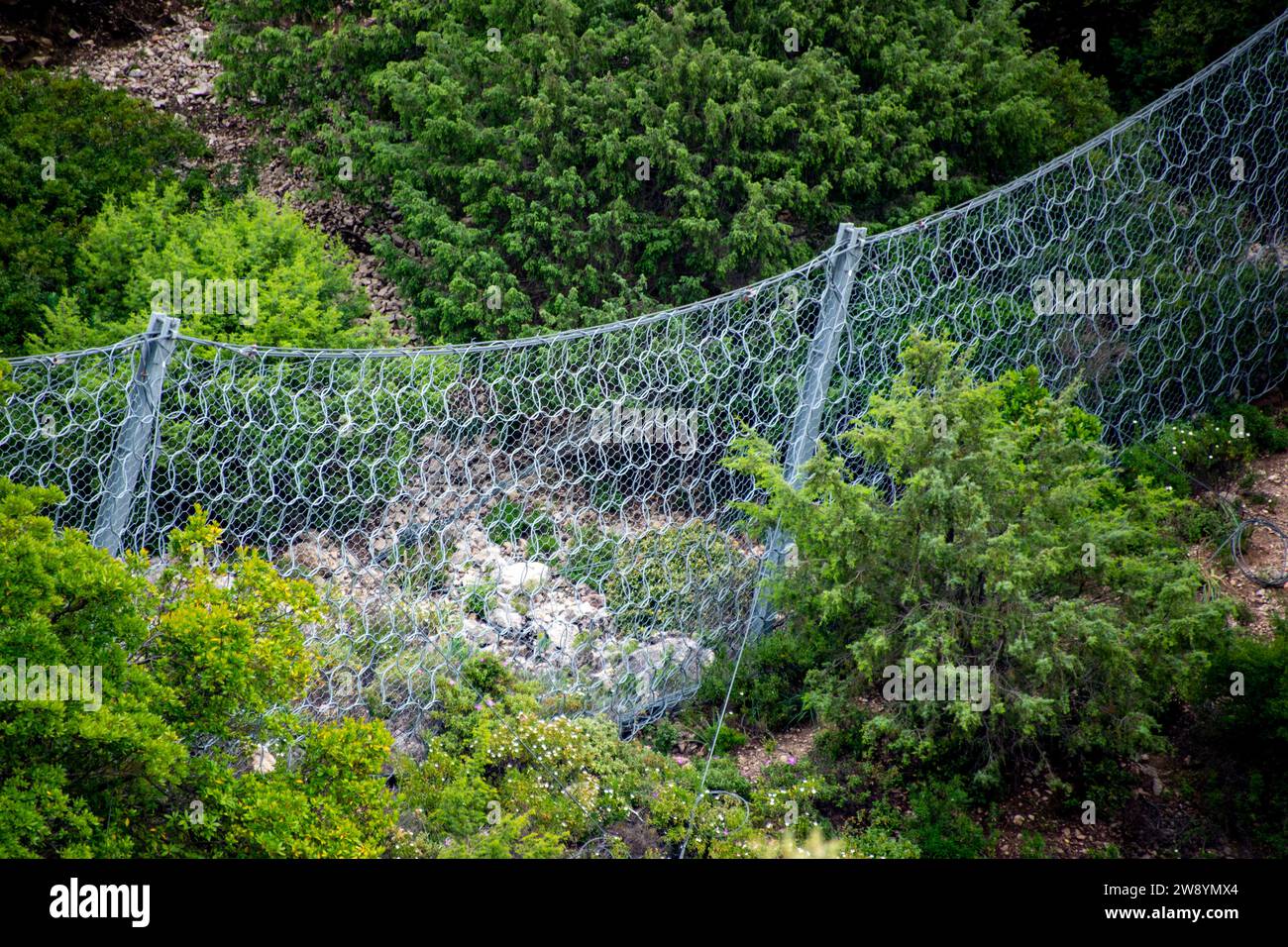 Rockfall Catchment Fence on a Hill Stock Photo - Alamy