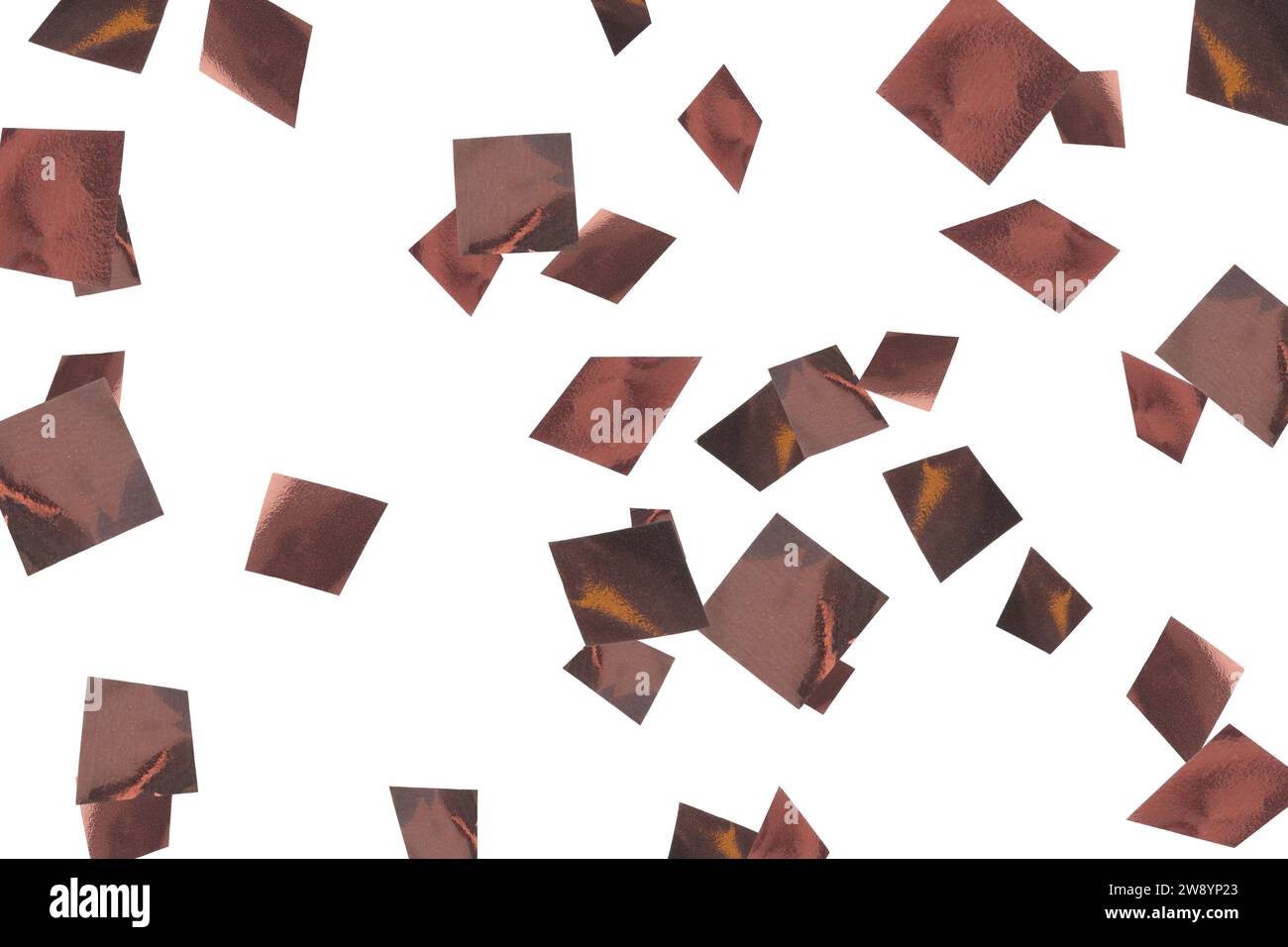 Shiny bronze confetti falling on white background Stock Photo - Alamy