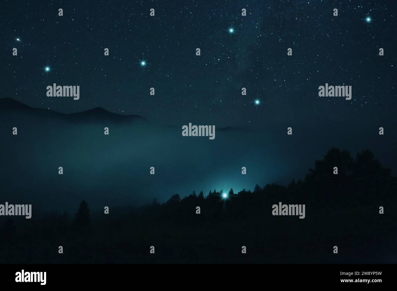 Foggy hill under starry sky at night Stock Photo - Alamy