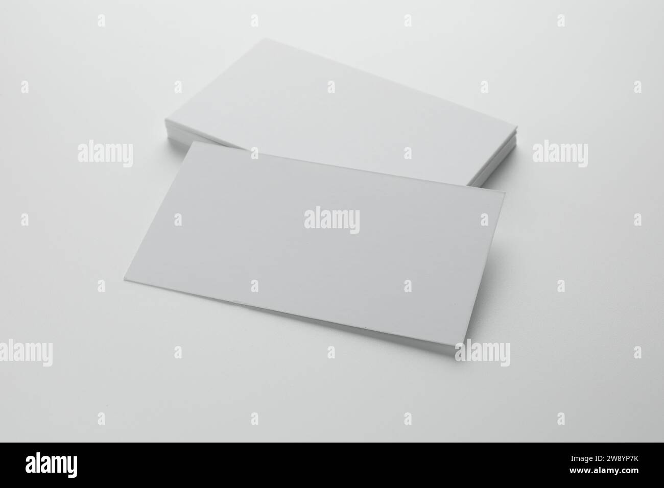 Blank business cards on white background. Mockup for design Stock Photo ...