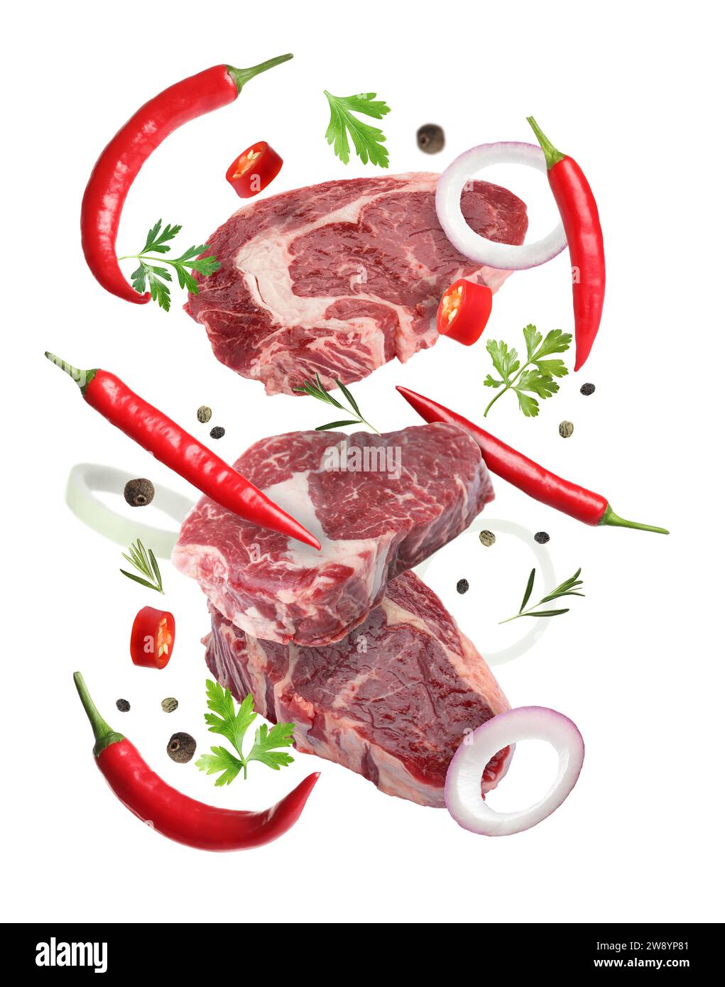 Beef meat and different spices falling on white background Stock Photo ...