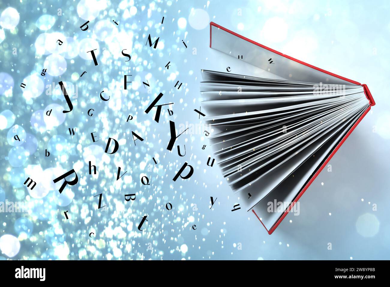 Open book with many letters on light blue background, top view. Bokeh ...