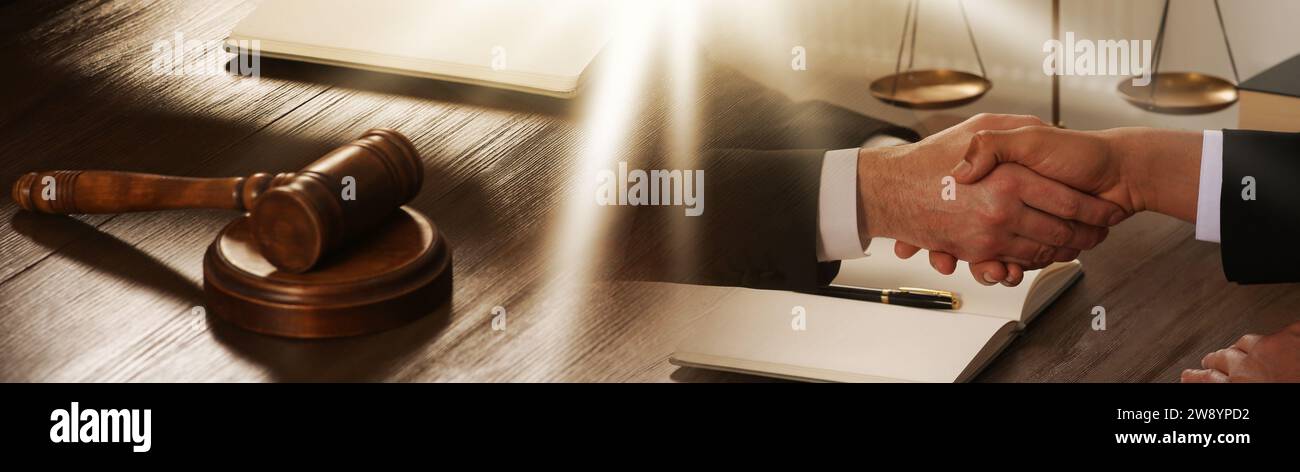 Law and justice. Double exposure of people shaking hands at wooden ...