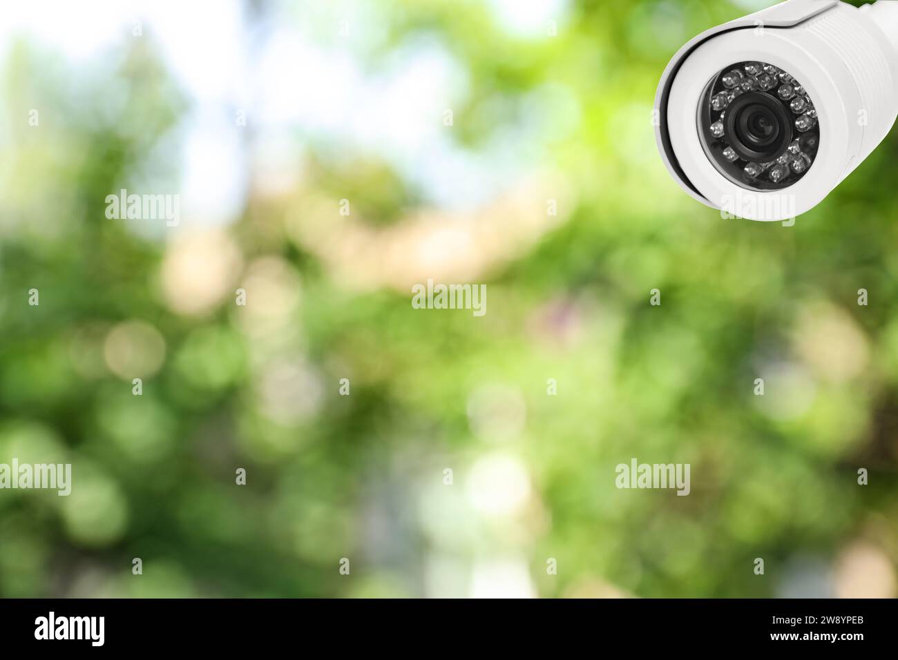 Modern security CCTV camera outdoors, space for text Stock Photo - Alamy