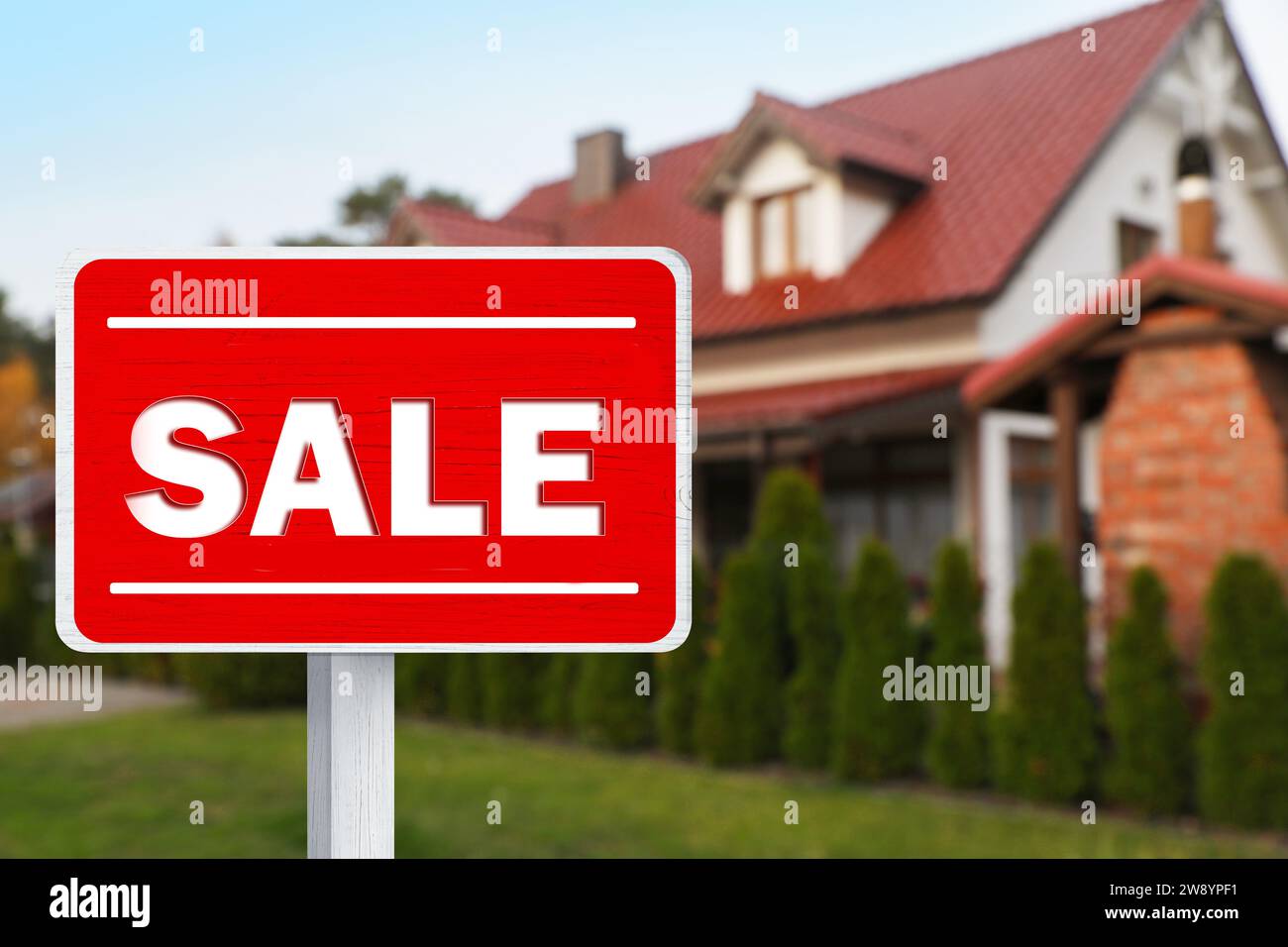 Sale sign near beautiful house outdoors. Red signboard with word Stock ...