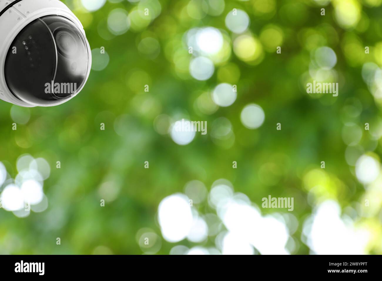 Modern security CCTV camera outdoors, space for text Stock Photo - Alamy