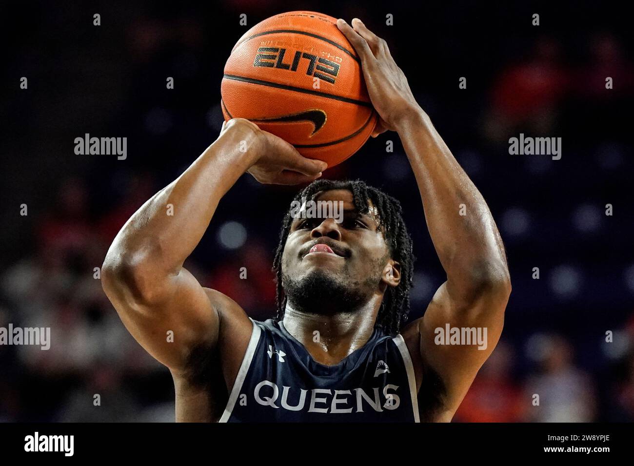 Queens University guard AJ McKee (5) shoots a freethrow against Clemson ...