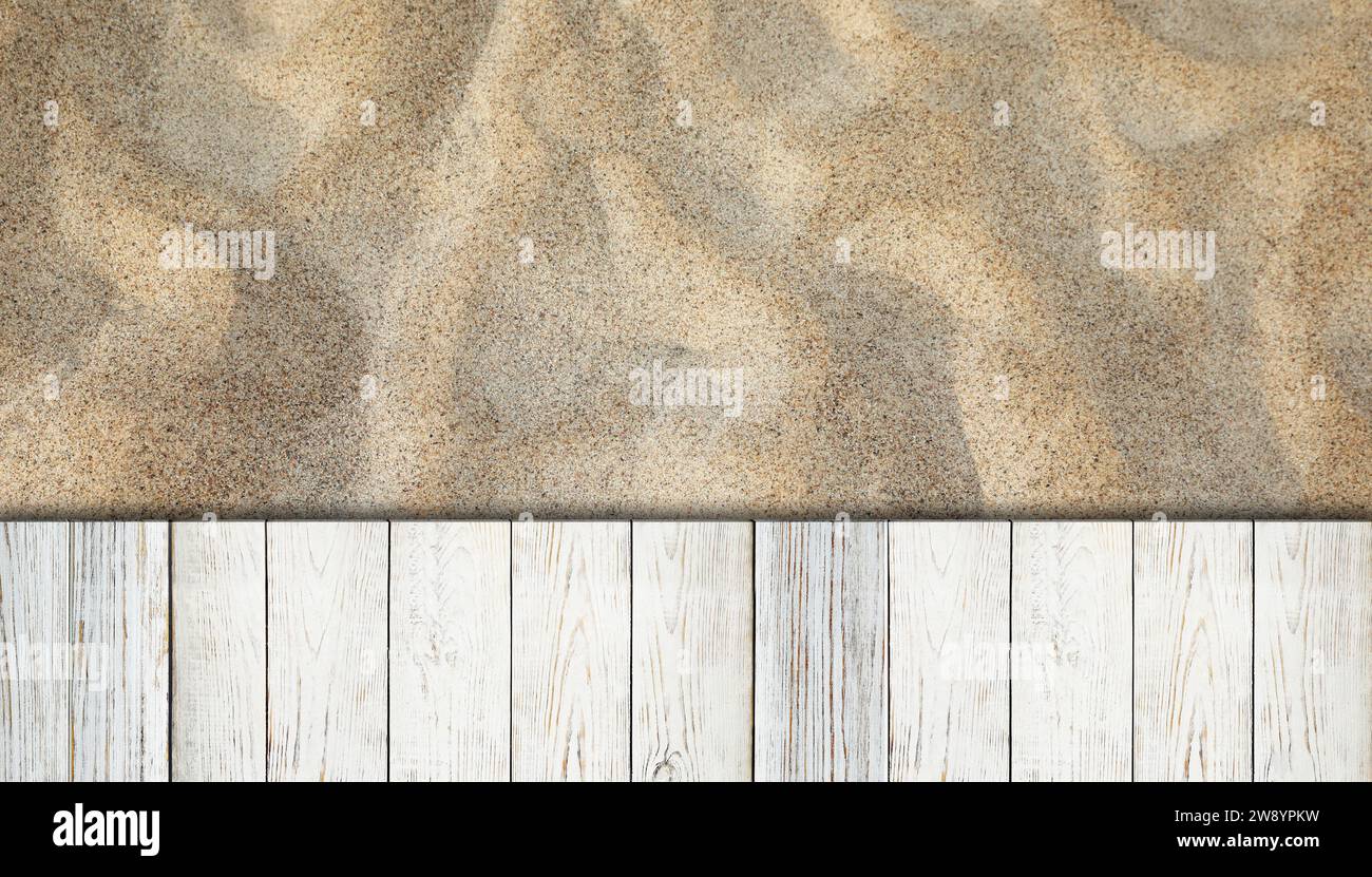 Sand and white wooden planks outdoors, top view. Banner design Stock Photo - Alamy