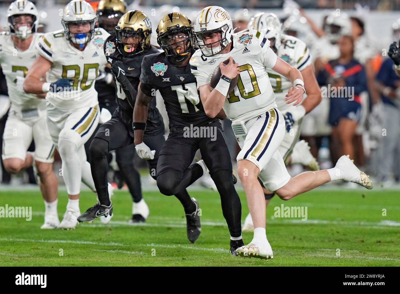 Georgia Tech quarterback Haynes King (10) is stopped by Central Florida ...