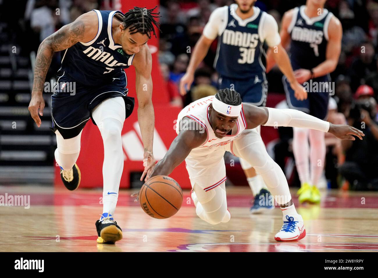 Dallas Mavericks guard A.J. Lawson, left, and Houston Rockets guard ...