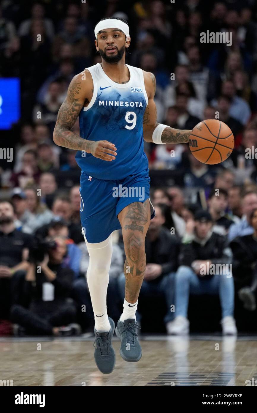 Minnesota Timberwolves guard Nickeil Alexander-Walker (9) dribbles down ...