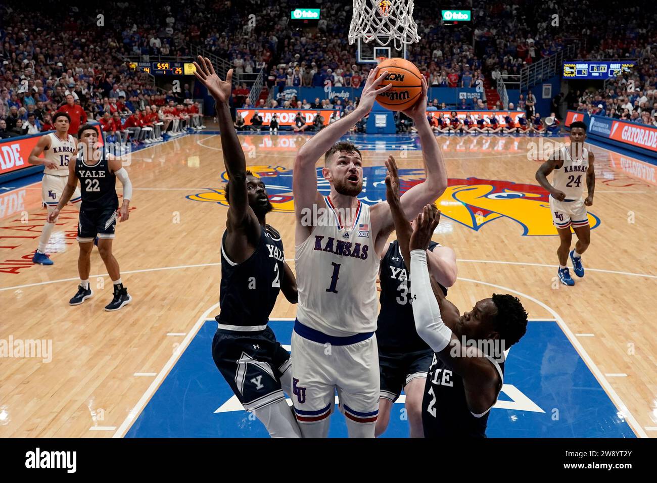 Kansas center Hunter Dickinson (1) shoots between Yale forward Yussif ...