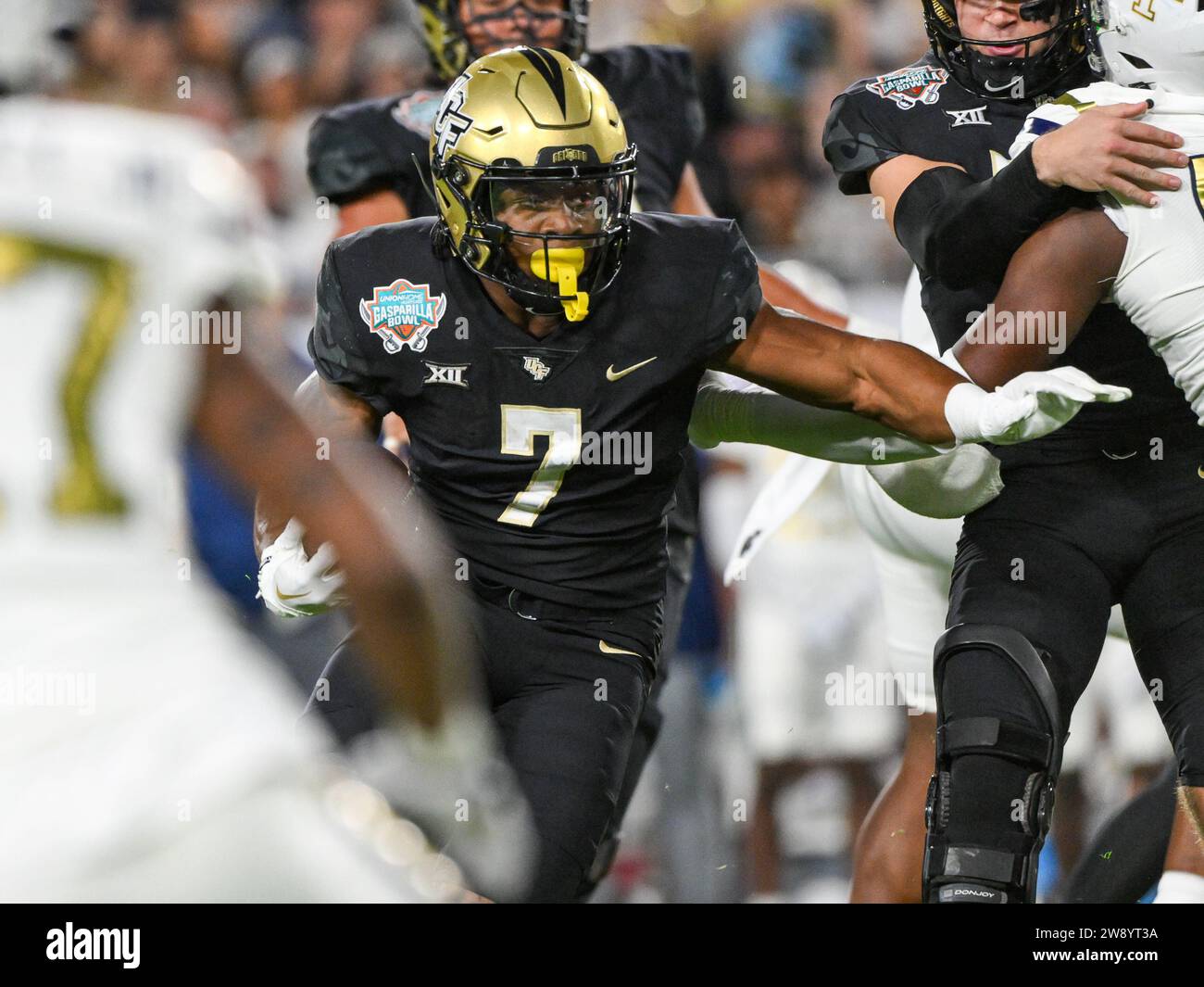 Tampa, FL, USA. 22nd Dec, 2023. UCF running back RJ Harvey (7) runs ...