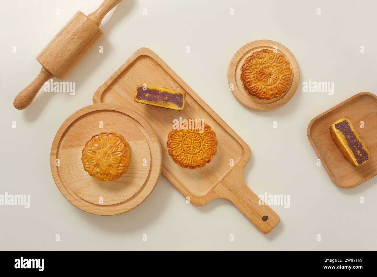 Against the white background, delicious mooncakes decorated on wooden ...