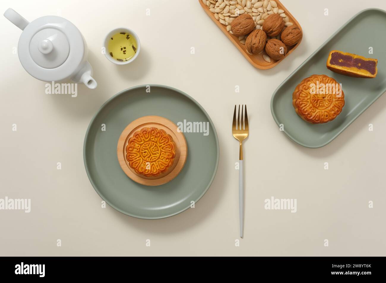 The small Mid-Autumn Festival party table is decorated with delicious ...