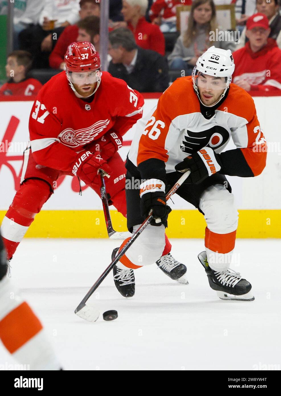 Philadelphia Flyers defenseman Sean Walker (26) is pursued by Detroit ...