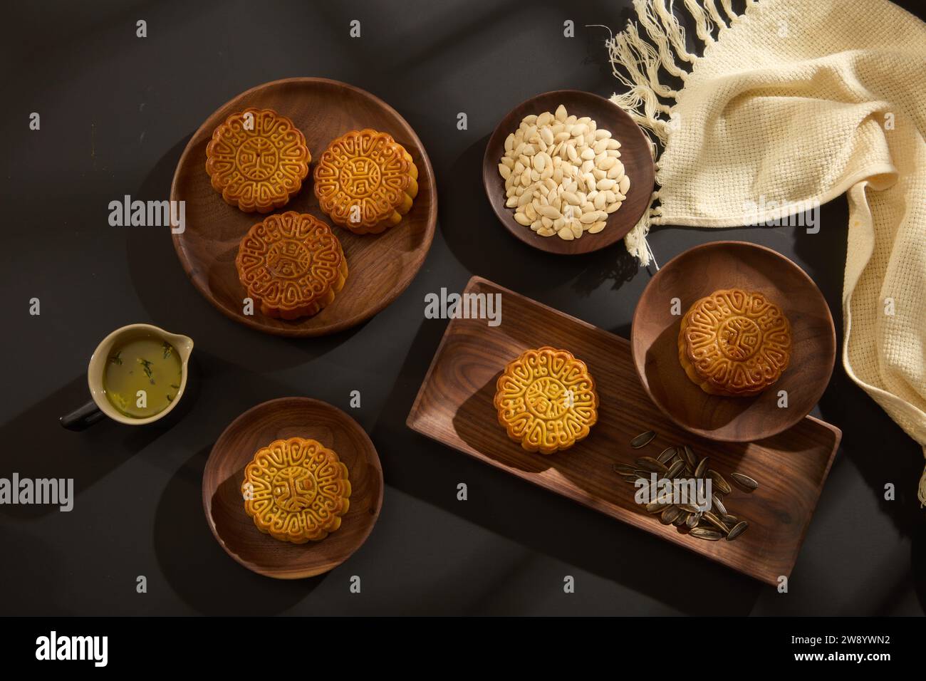 Chinese Mid-Autumn Festival concept made from mooncakes on wooden trays ...