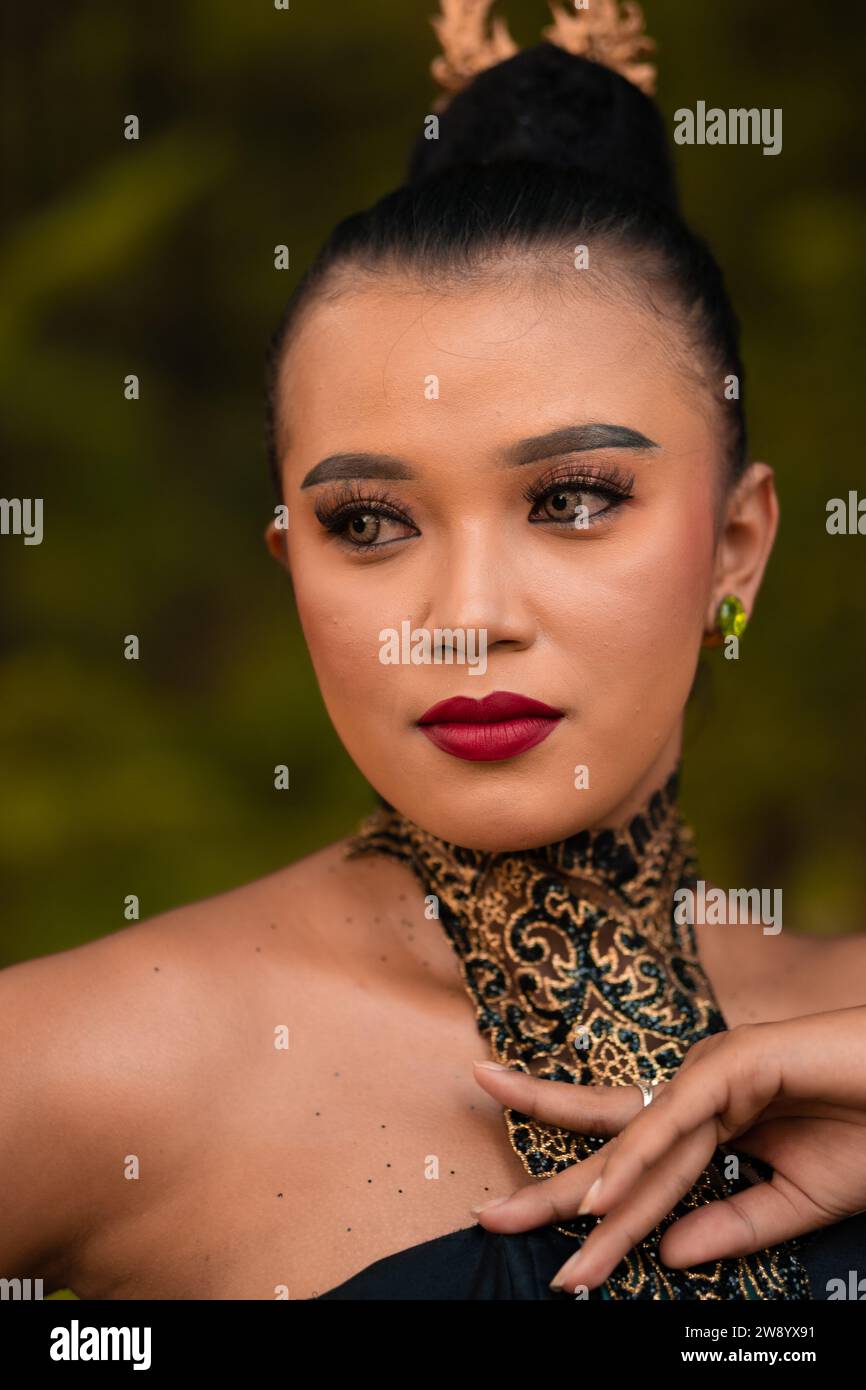 Beautiful eyes of an Asian woman in makeup and red lipstick while ...
