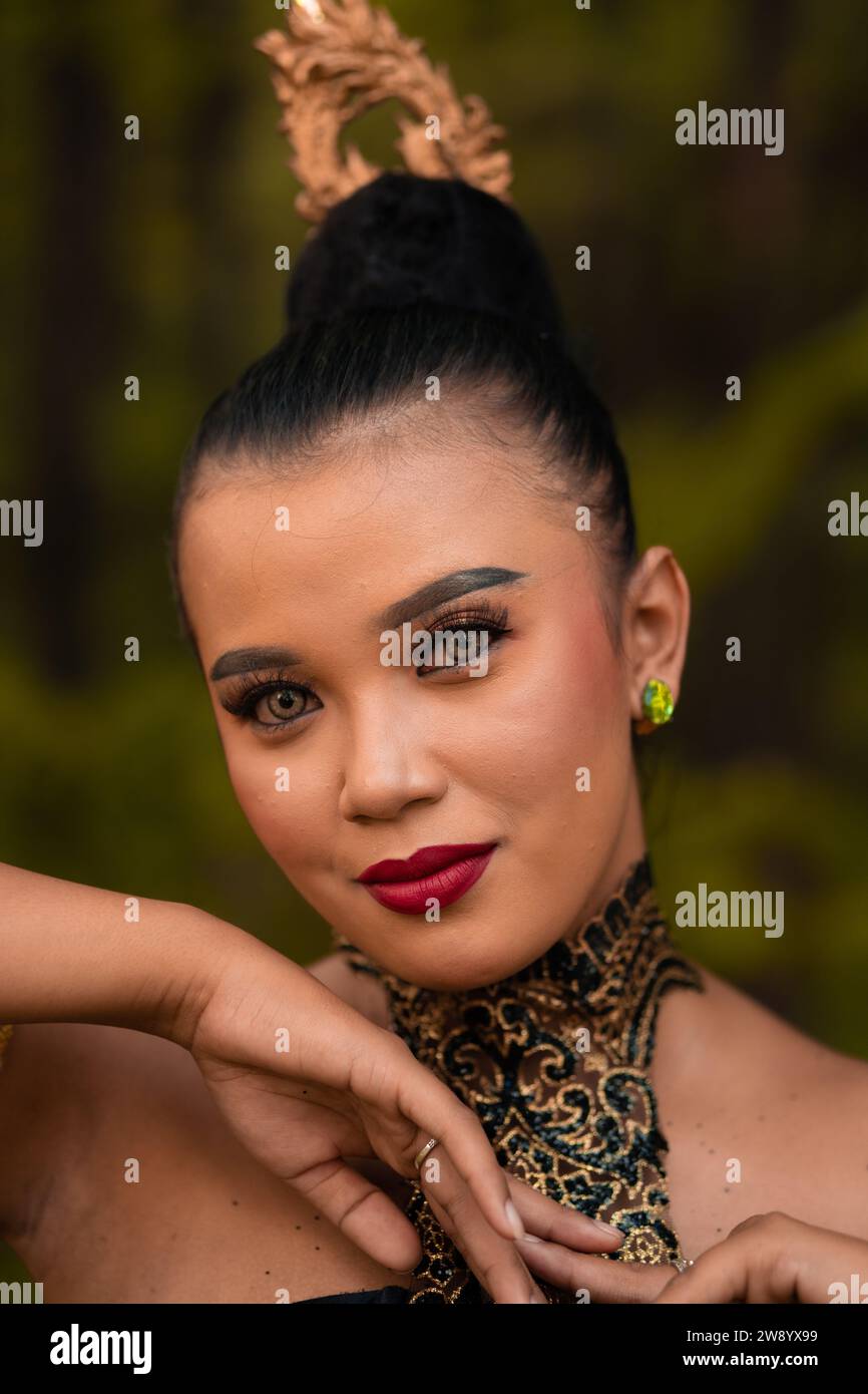 Beautiful eyes of an Asian woman in makeup and red lipstick while ...
