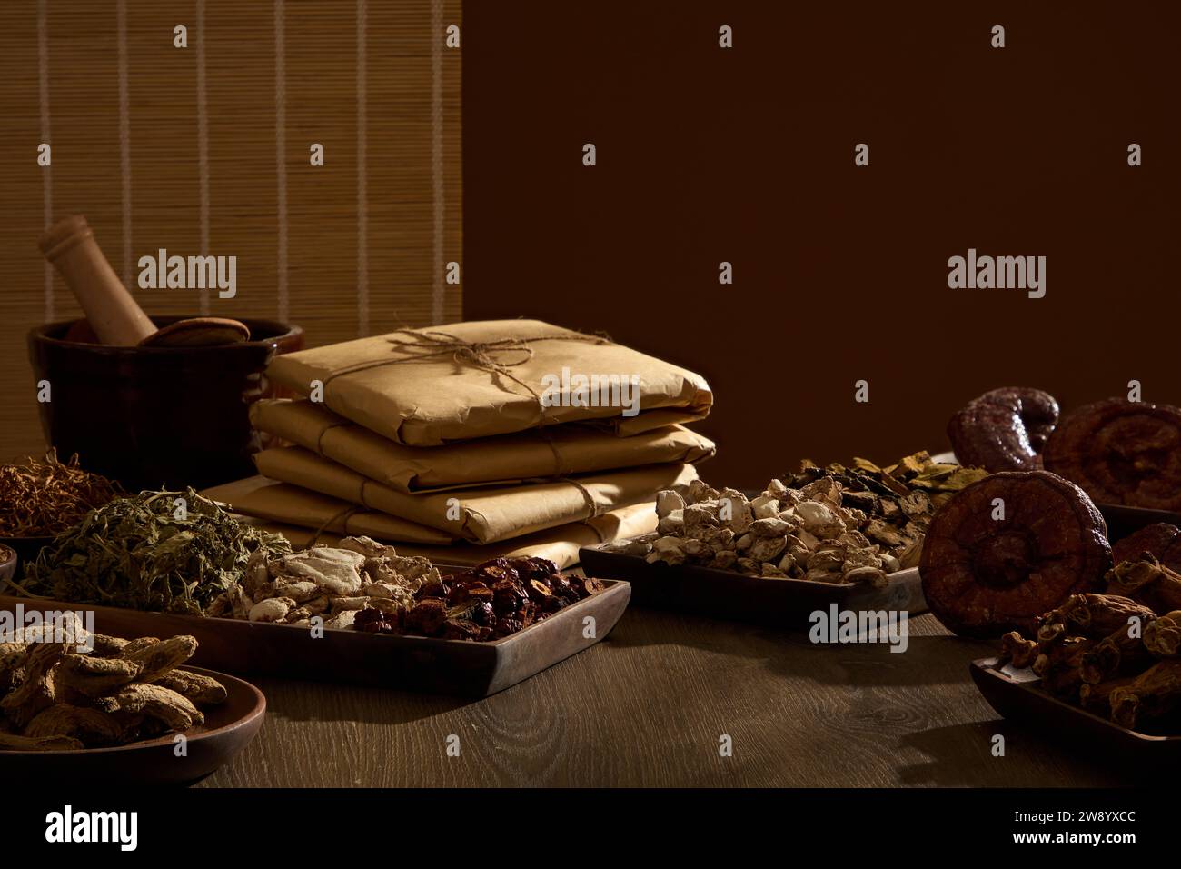 Traditional Chinese medicine with herbs and folk remedies on a classic ...