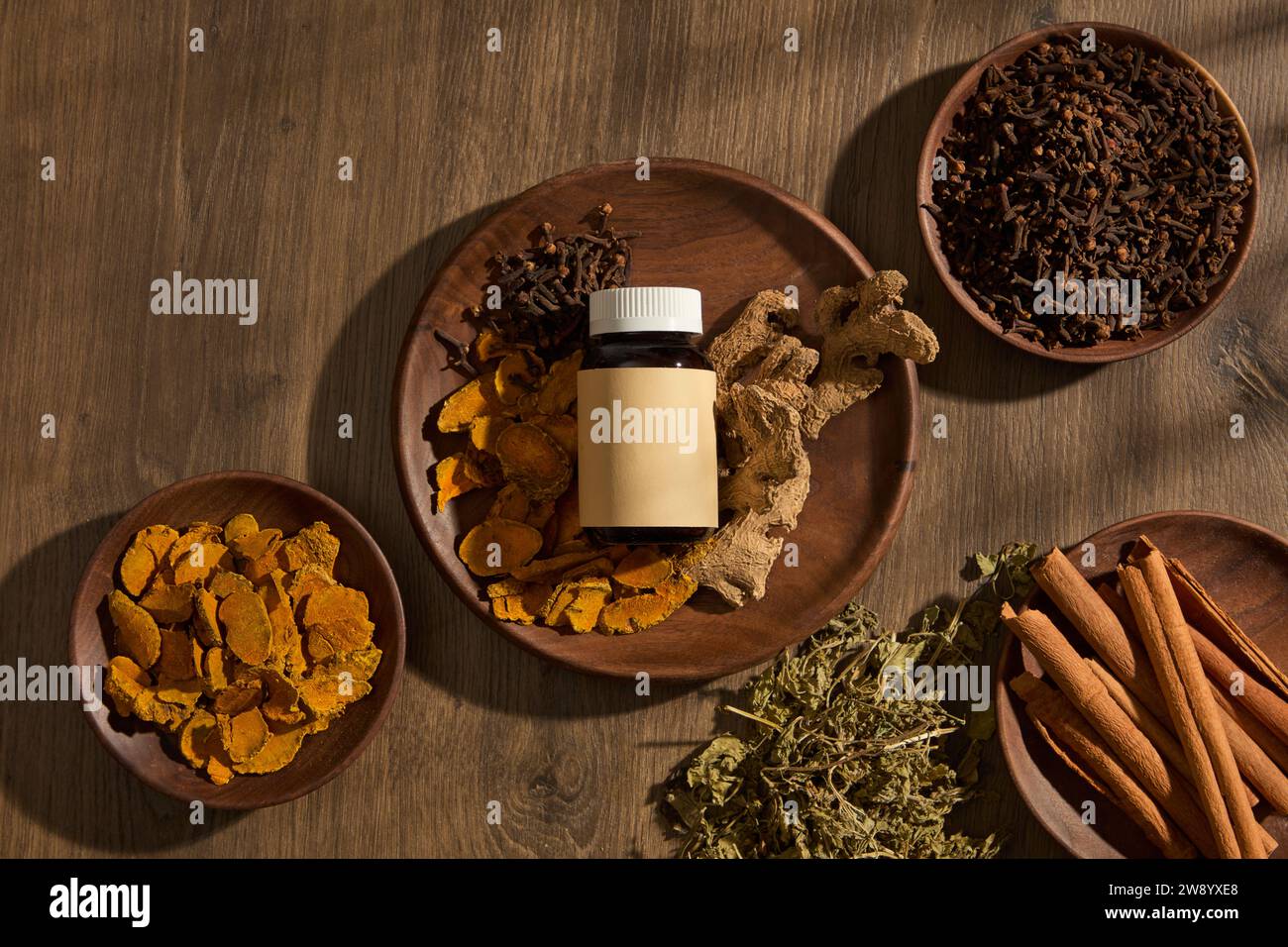 On wooden plates containing folk medicines such as ginger, turmeric ...