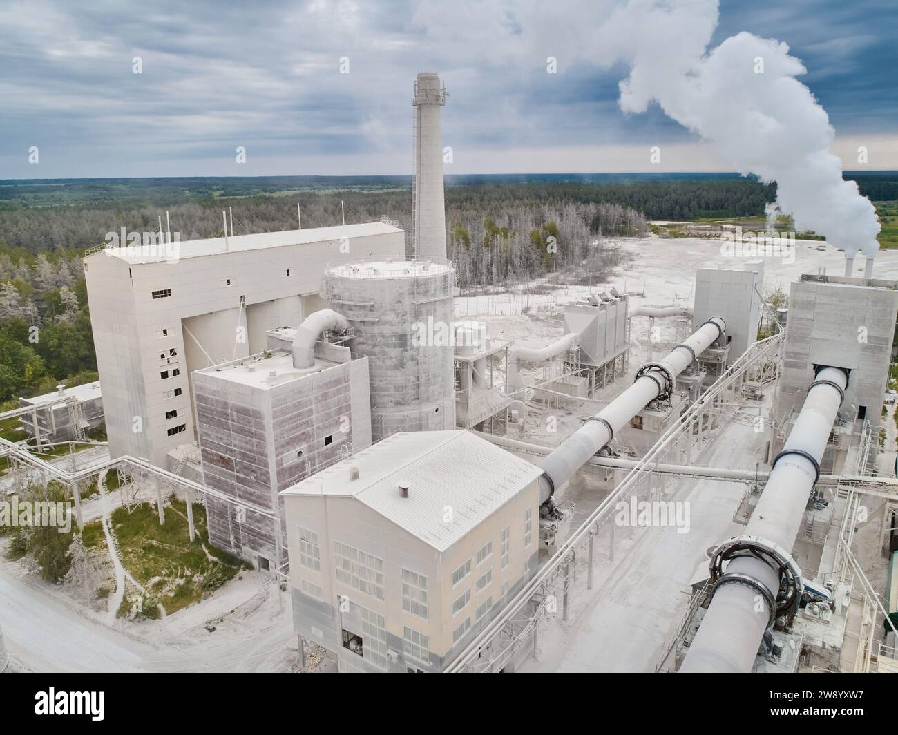 Calx roasting rotating furnace with pipe and steam at plant Stock Photo ...