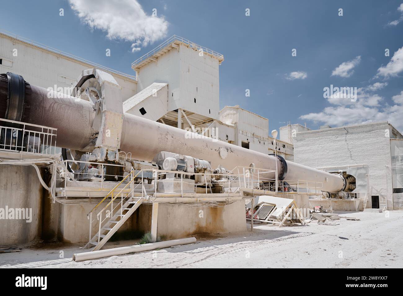 Tubular rotary furnace and smoking chimney at factory Stock Photo - Alamy