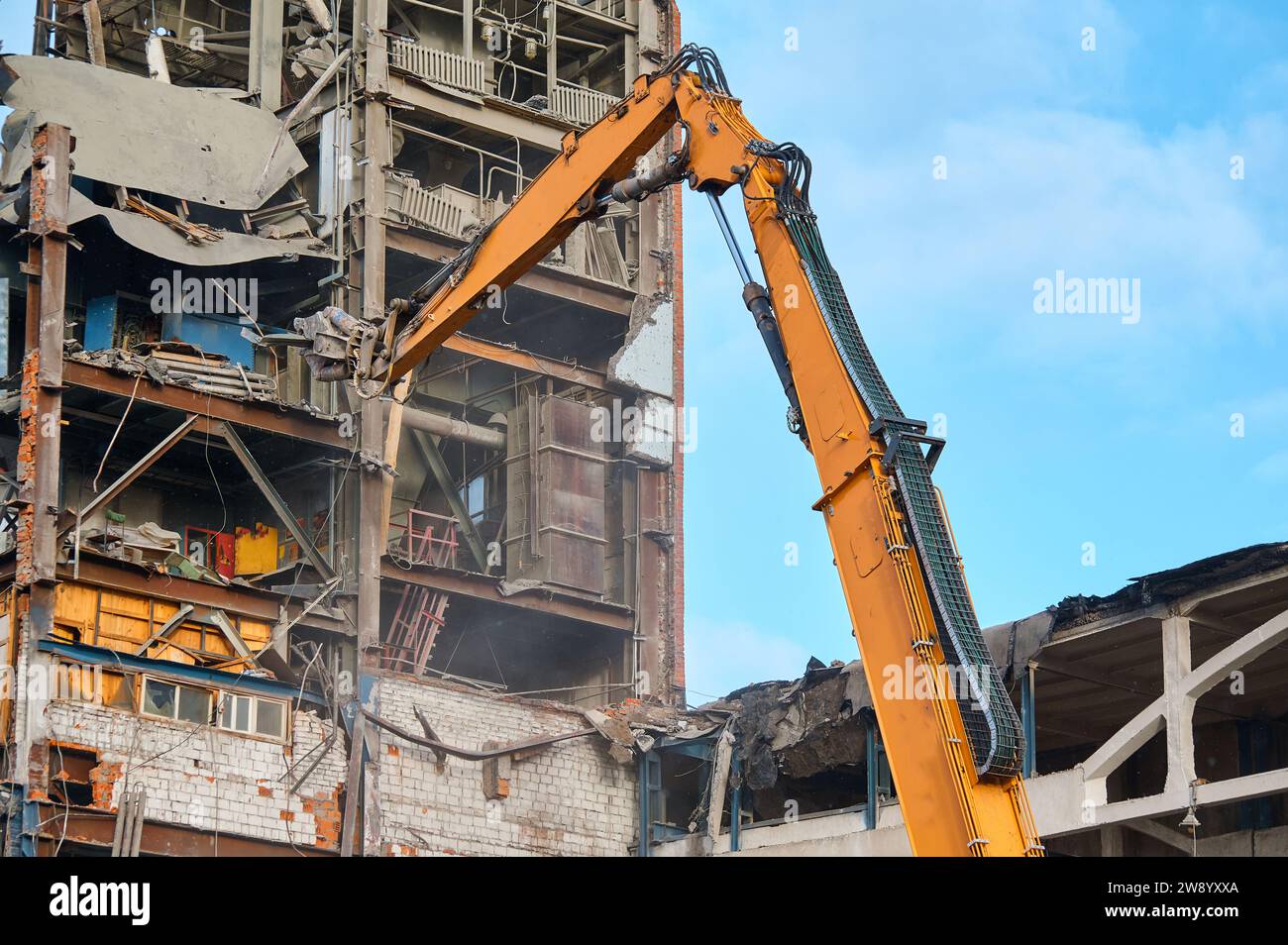 Destroying of old industrial building by excavator destroyer Stock ...