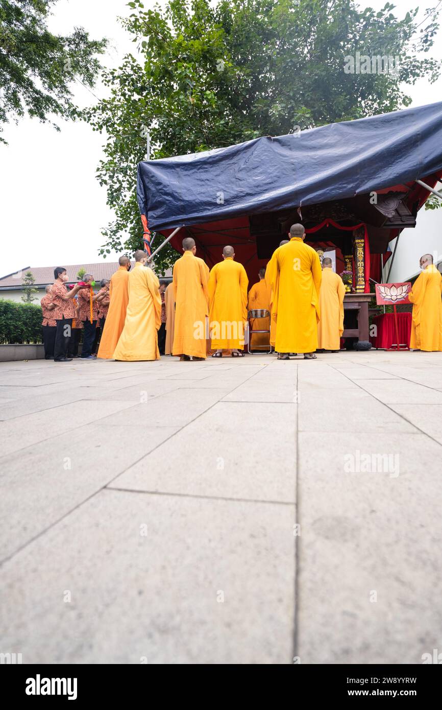 Bandung, Indonesia - January 8, 2022 : The monks in orange rob standing ...