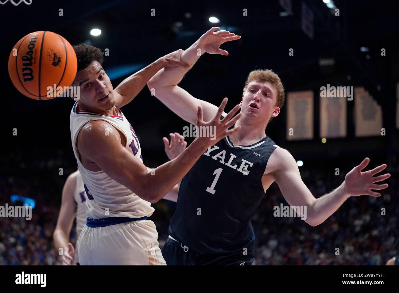 Kansas guard Kevin McCullar Jr., left, and Yale forward Danny Wolf (1 ...