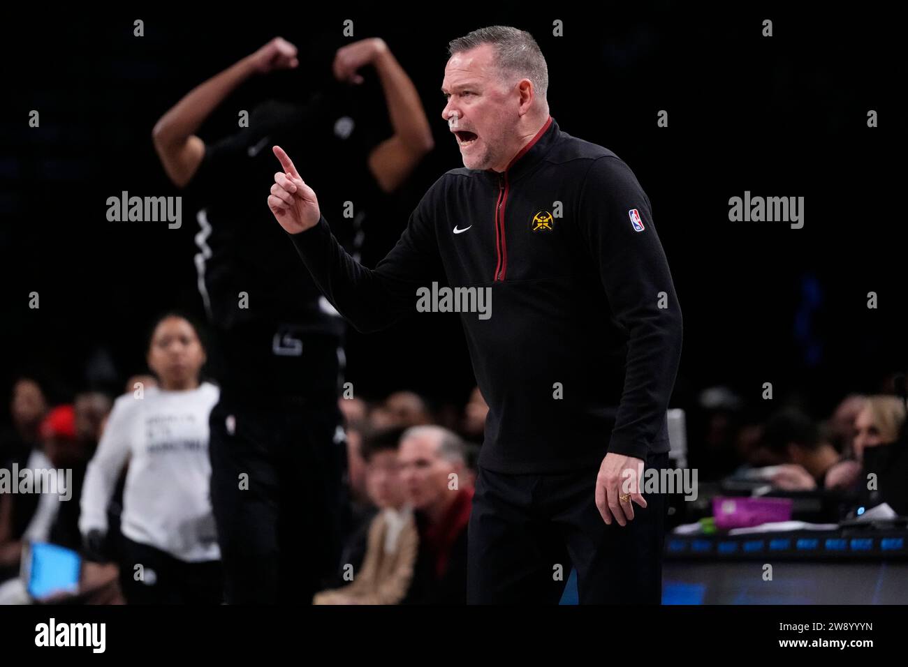 Denver Nuggets head coach Michael Malone calls out to his team during ...