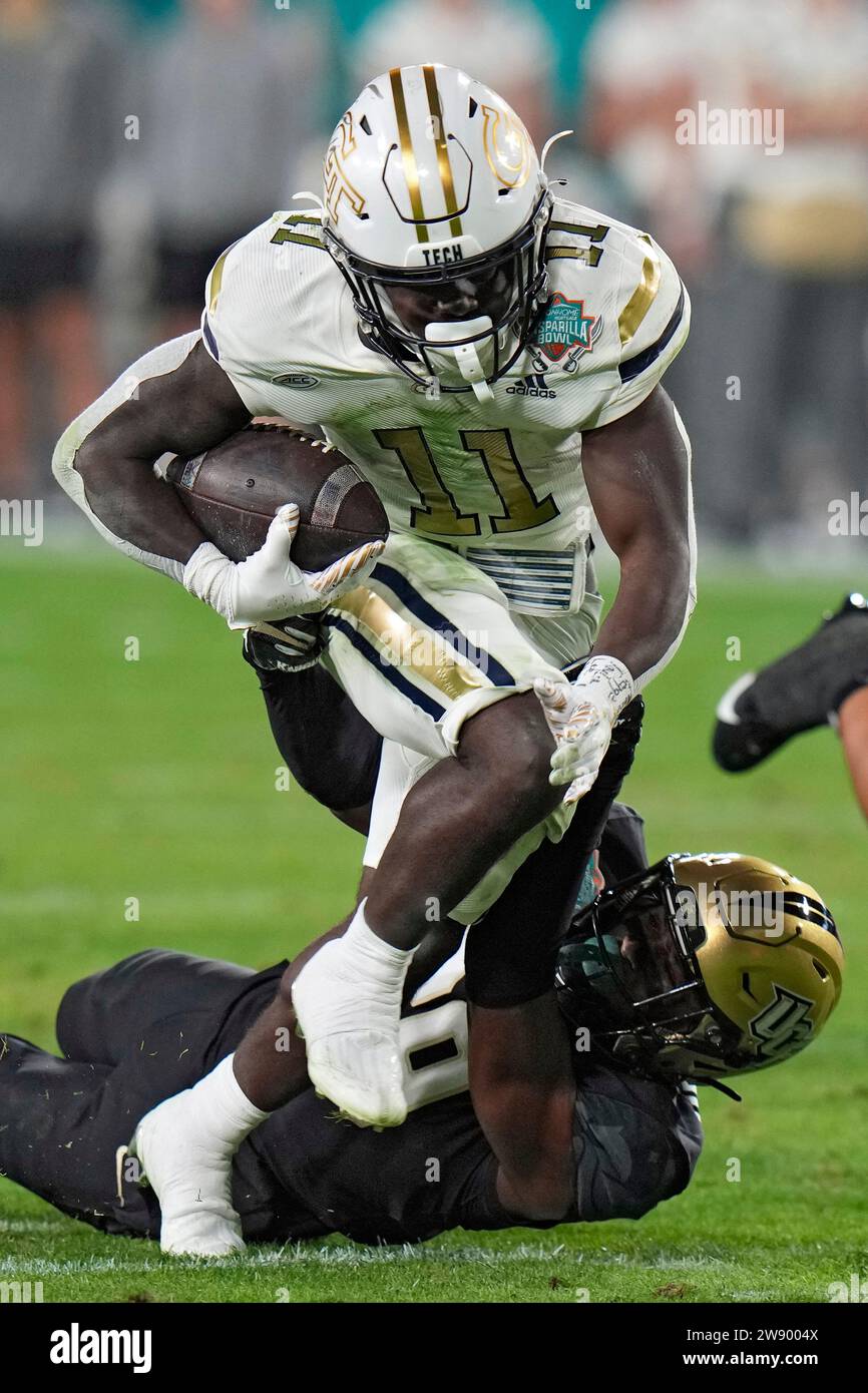 Georgia Tech running back Jamal Haynes (11) runs over Central Florida ...