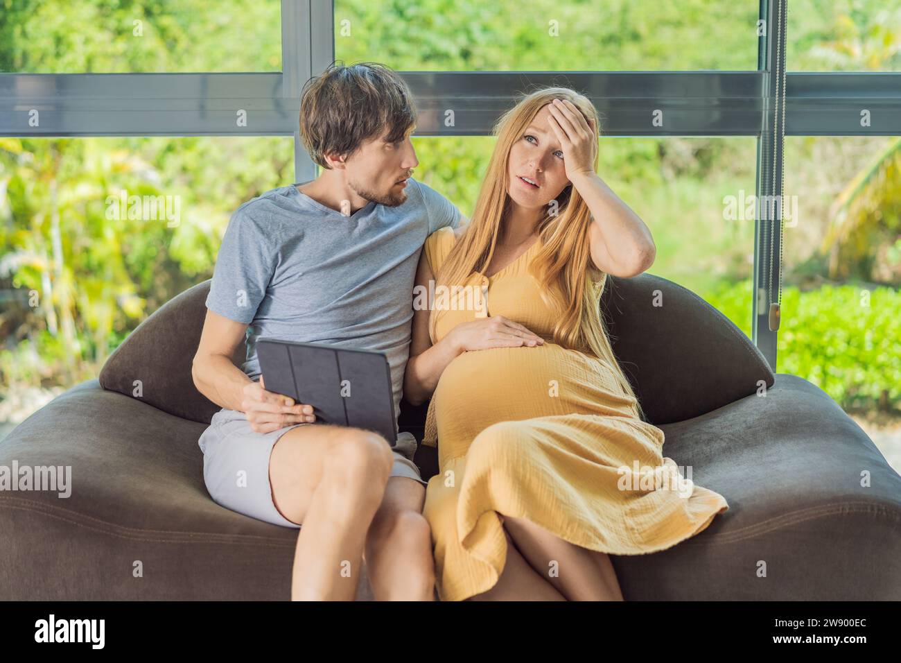 Cost of Pregnancy And Family Budgeting Concept. Young couple expecting ...