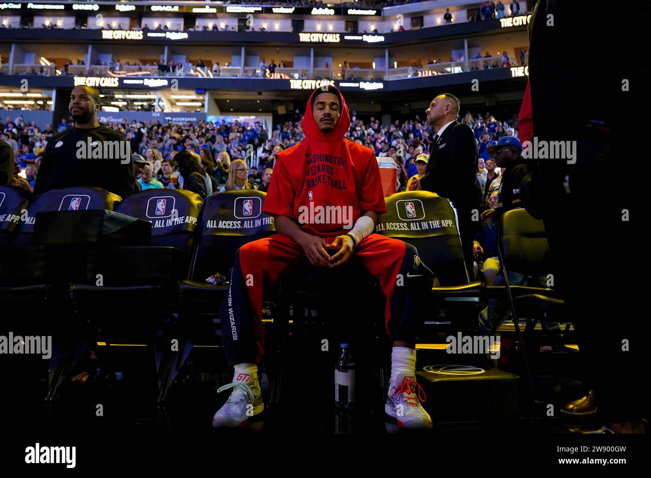 Washington Wizards guard Jordan Poole sits on the bench before the team ...