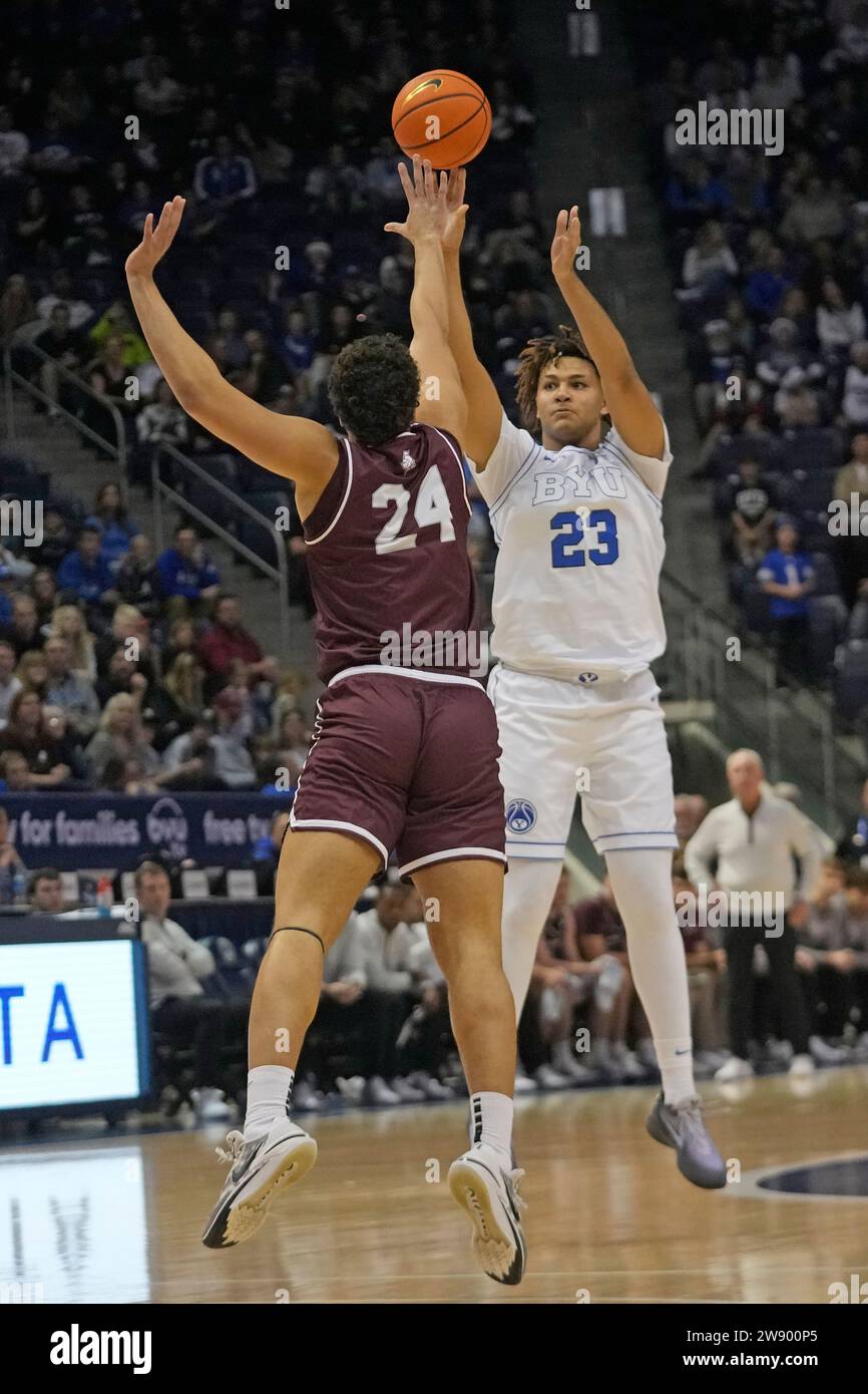 BYU forward Marcus Adams (23) shoots as Bellarmine forward Eli Roberts ...
