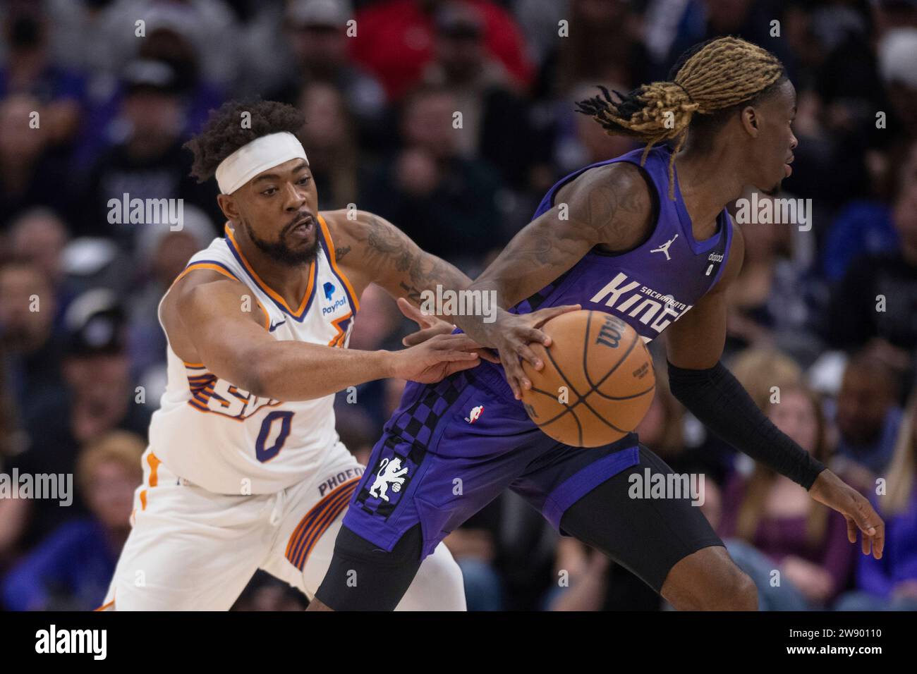 Phoenix Suns guard Jordan Goodwin (0) reaches for the ball dribbled by ...