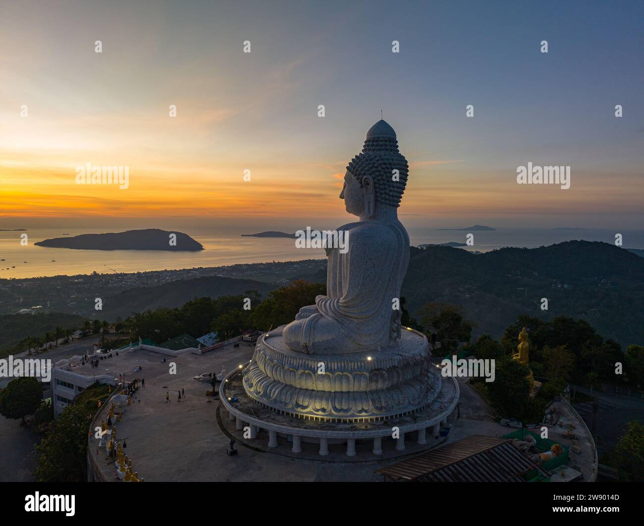 aerial view scenery yellow sky glare of sun above Phuket big Buddha ...