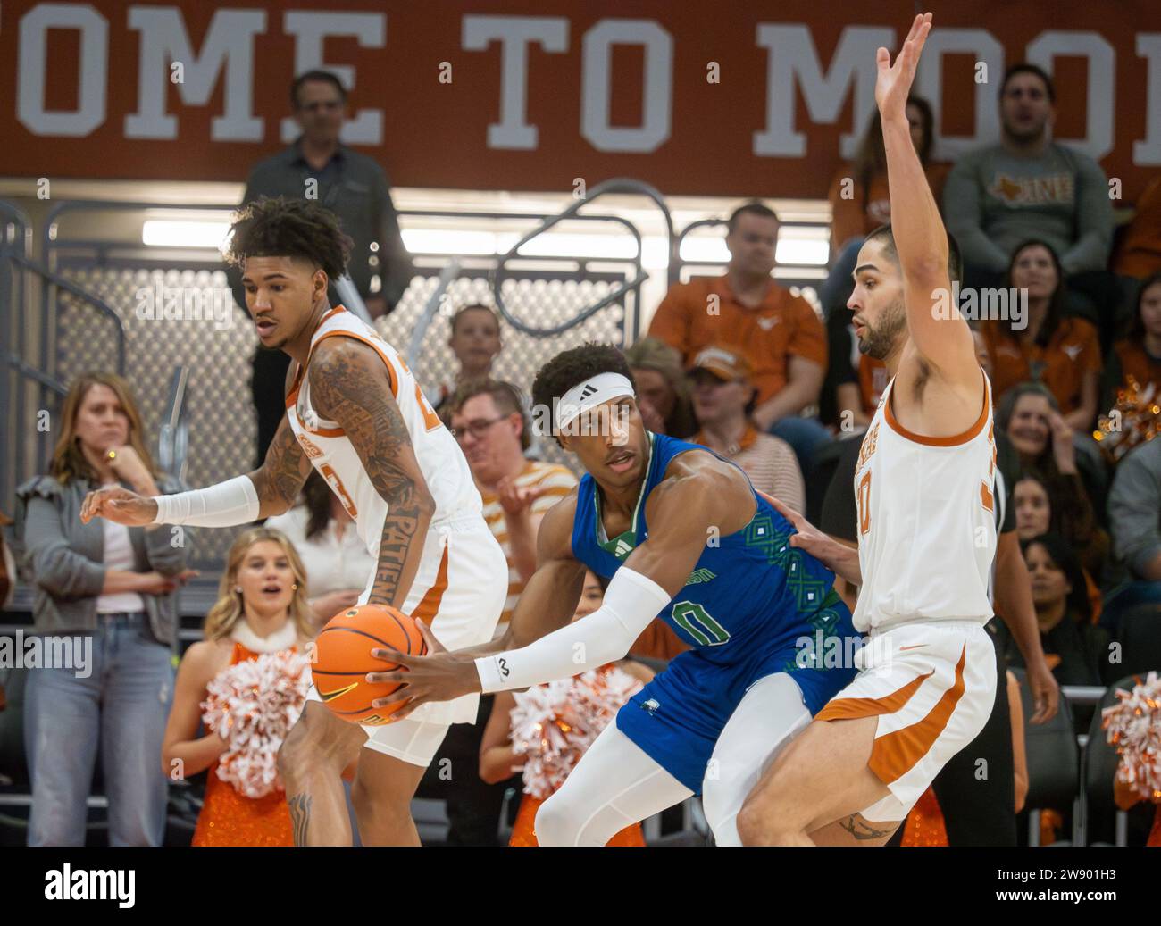 Texas A&M Corpus Christi guard Chris Johnson, center, looks to pass ...