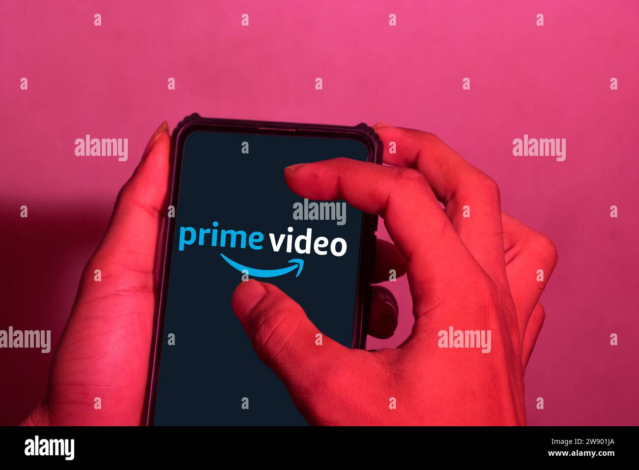 Closeup of a hand, This photo illustration shows the company logo for ...