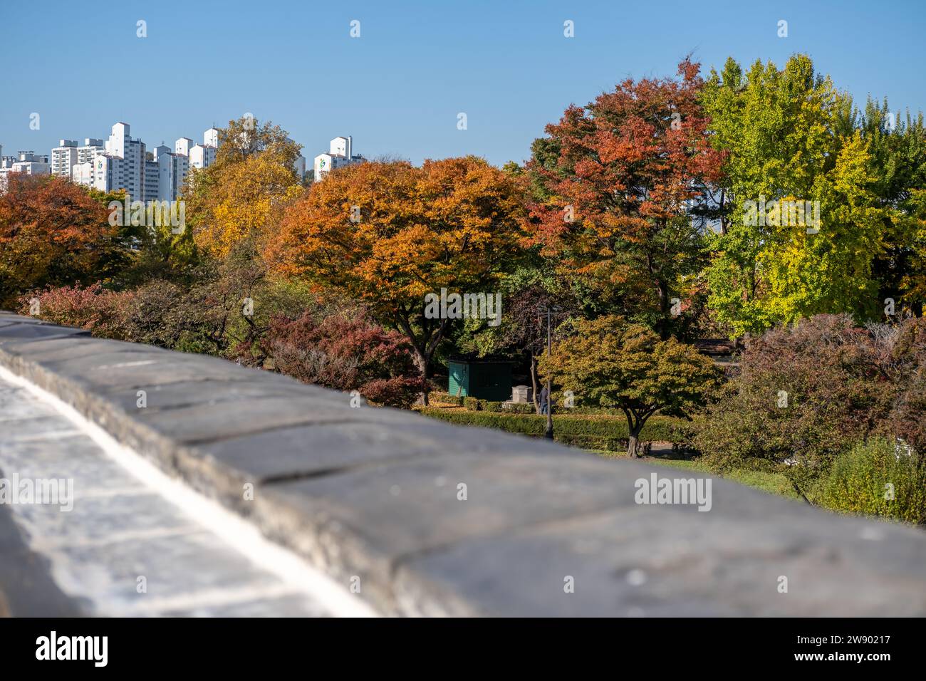 Suwon Hwaseong Fortress Wall, with the park view during autumn. The ...