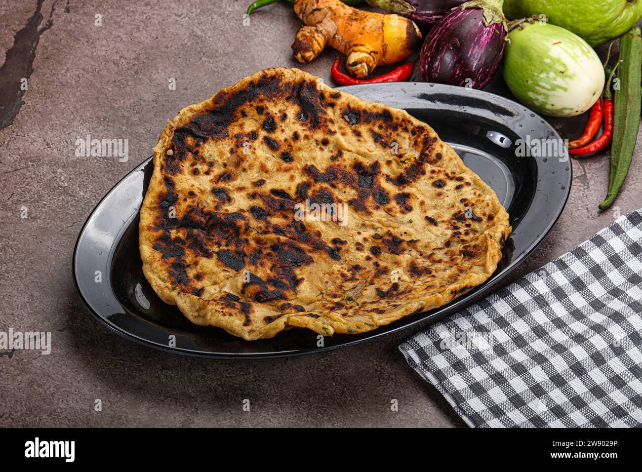 Indian cuisine stuffed Aloo paratha - bread with potato Stock Photo - Alamy
