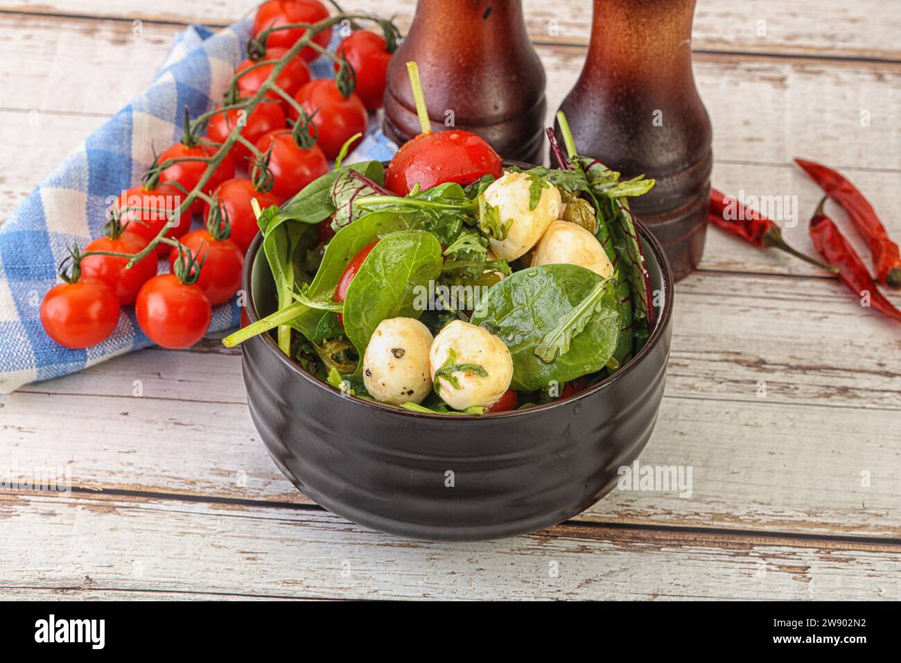 Mix salad with mini mozzarella and tomato Stock Photo - Alamy