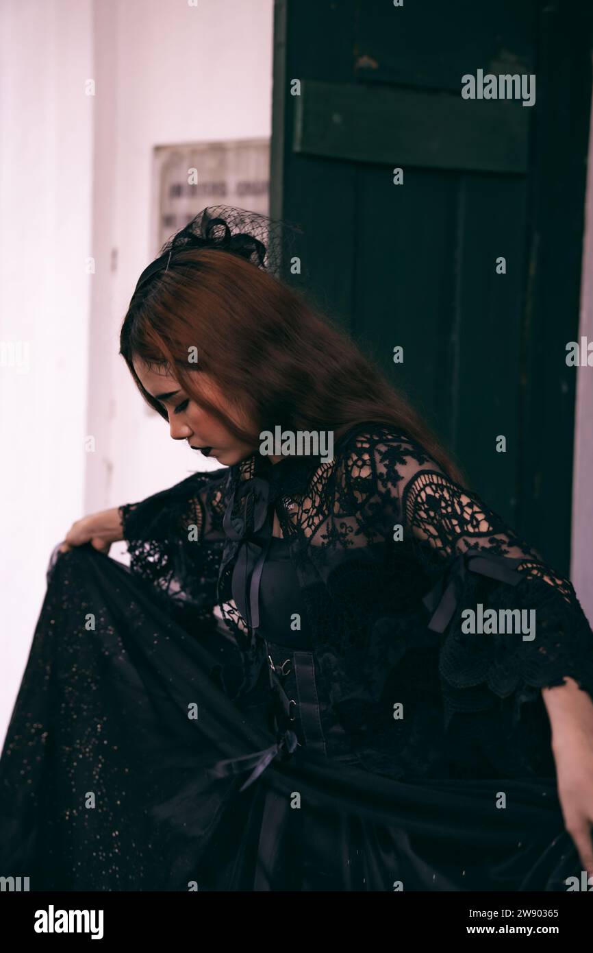 a mysterious Asian woman in black clothes and robes silently visited ...