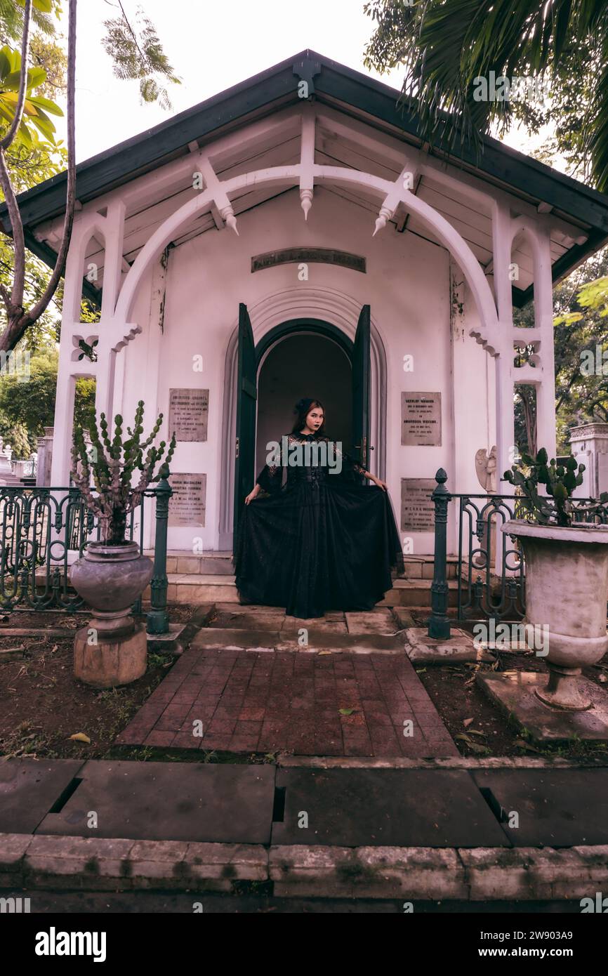 a witch in an all black dress and scary makeup was standing at the ...