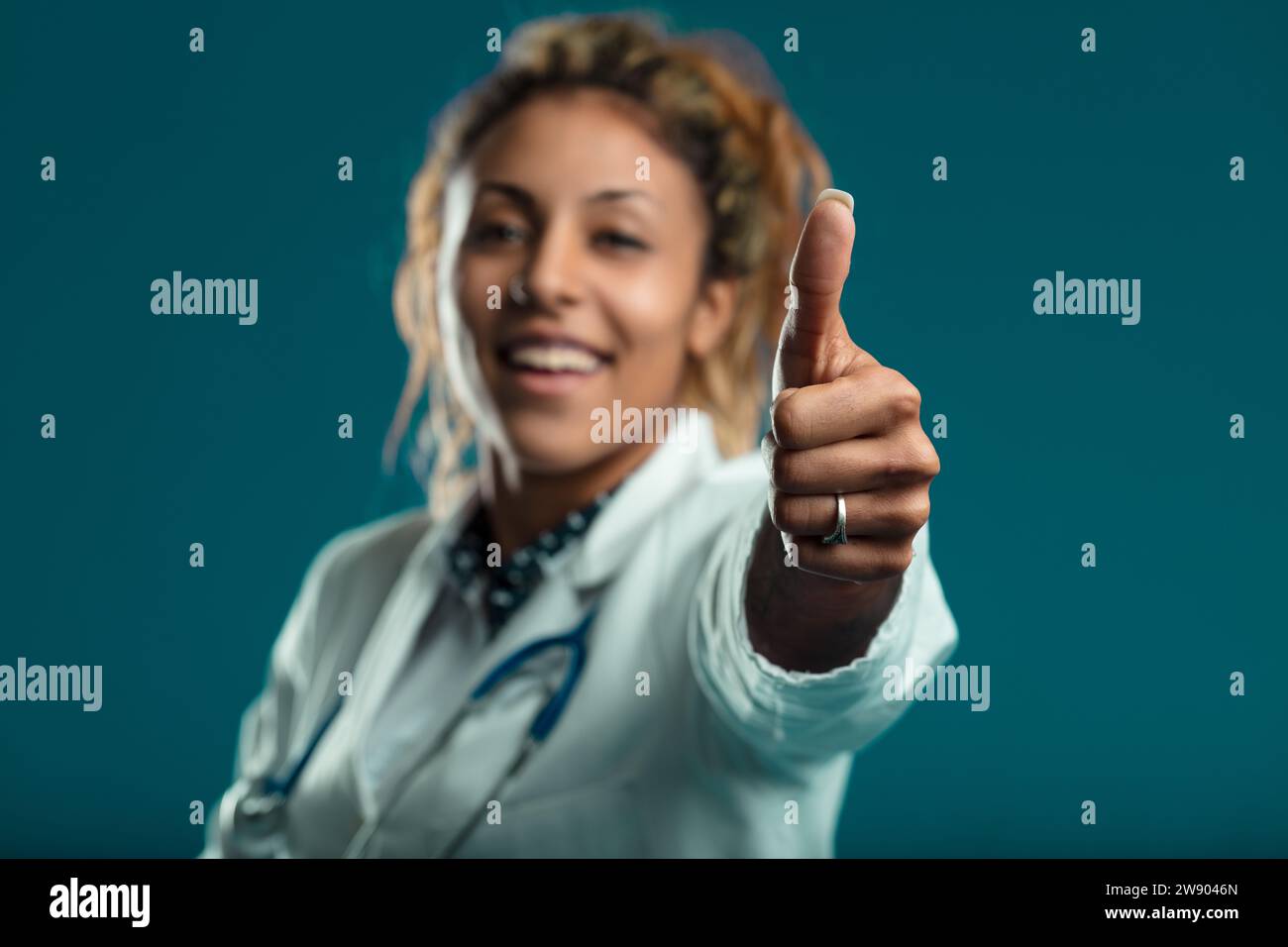 With a bright smile and a positive sign, she embodies the cheerful ...