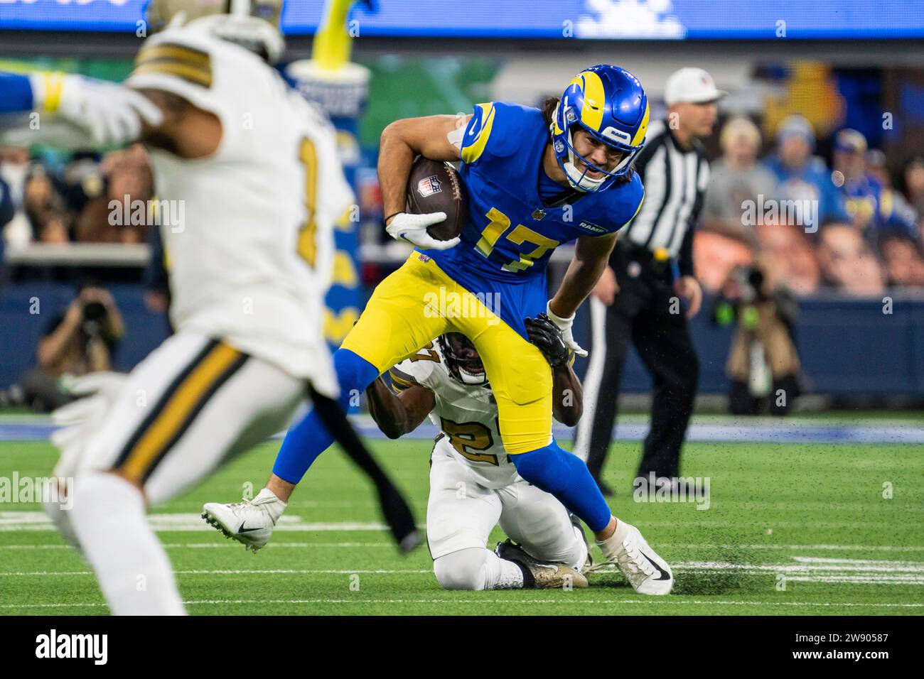 Los Angeles Rams wide receiver Puka Nacua (17) is tackled by New Orleans Saints cornerback Isaac ...