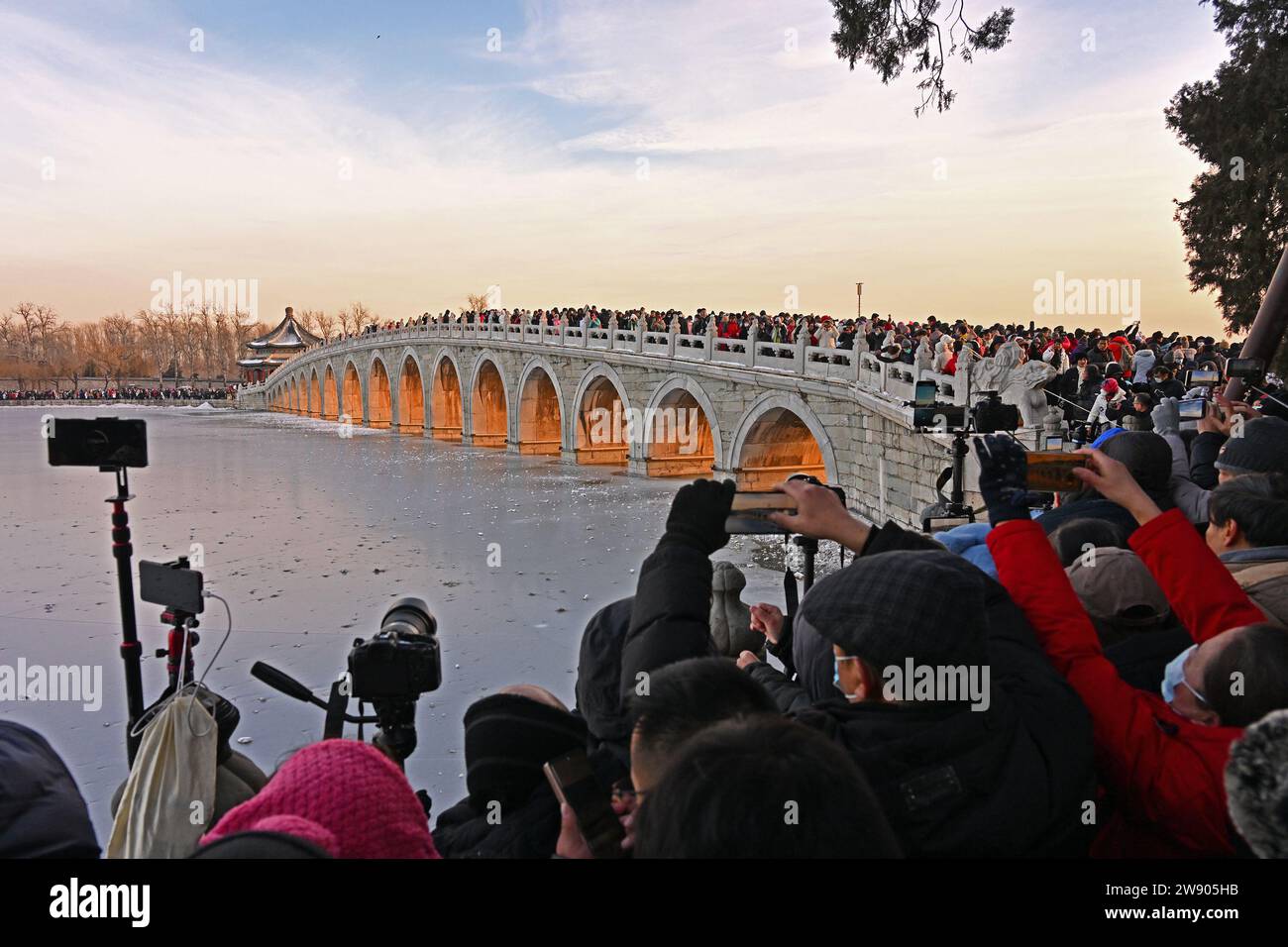 Beijing, China. 22nd Dec, 2023. Visitors take pictures of the Seventeen ...