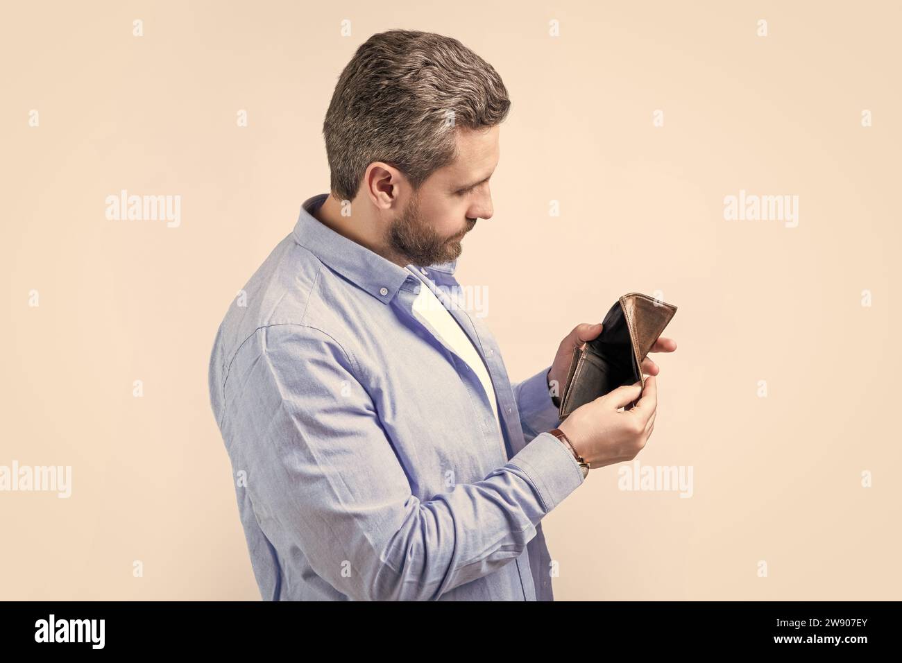 poor bankrupt man with wallet isolated on studio background. bankrupt ...